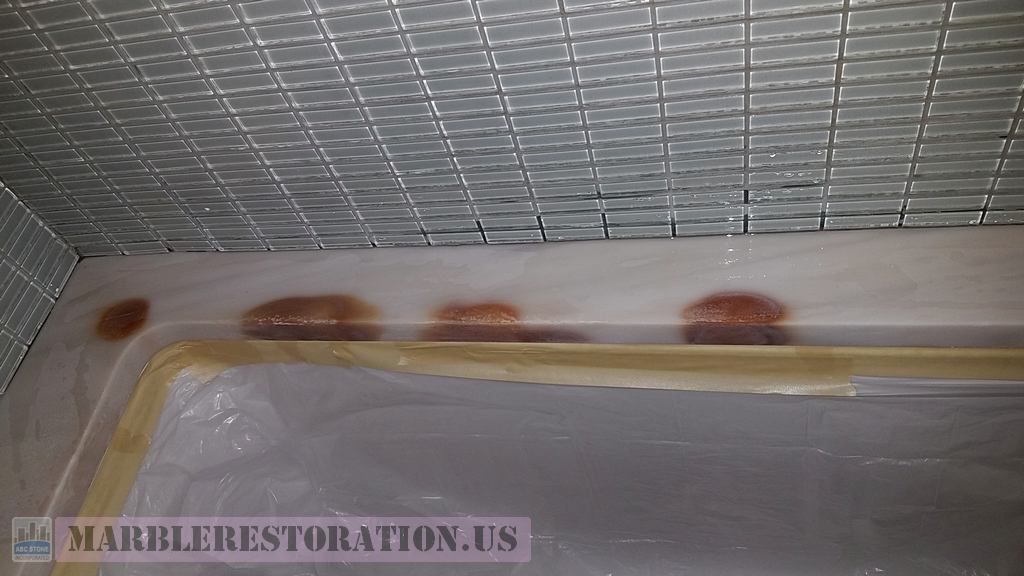 Brown Rust Stains On Marble TubTop Edge - ABC Stone Inc.